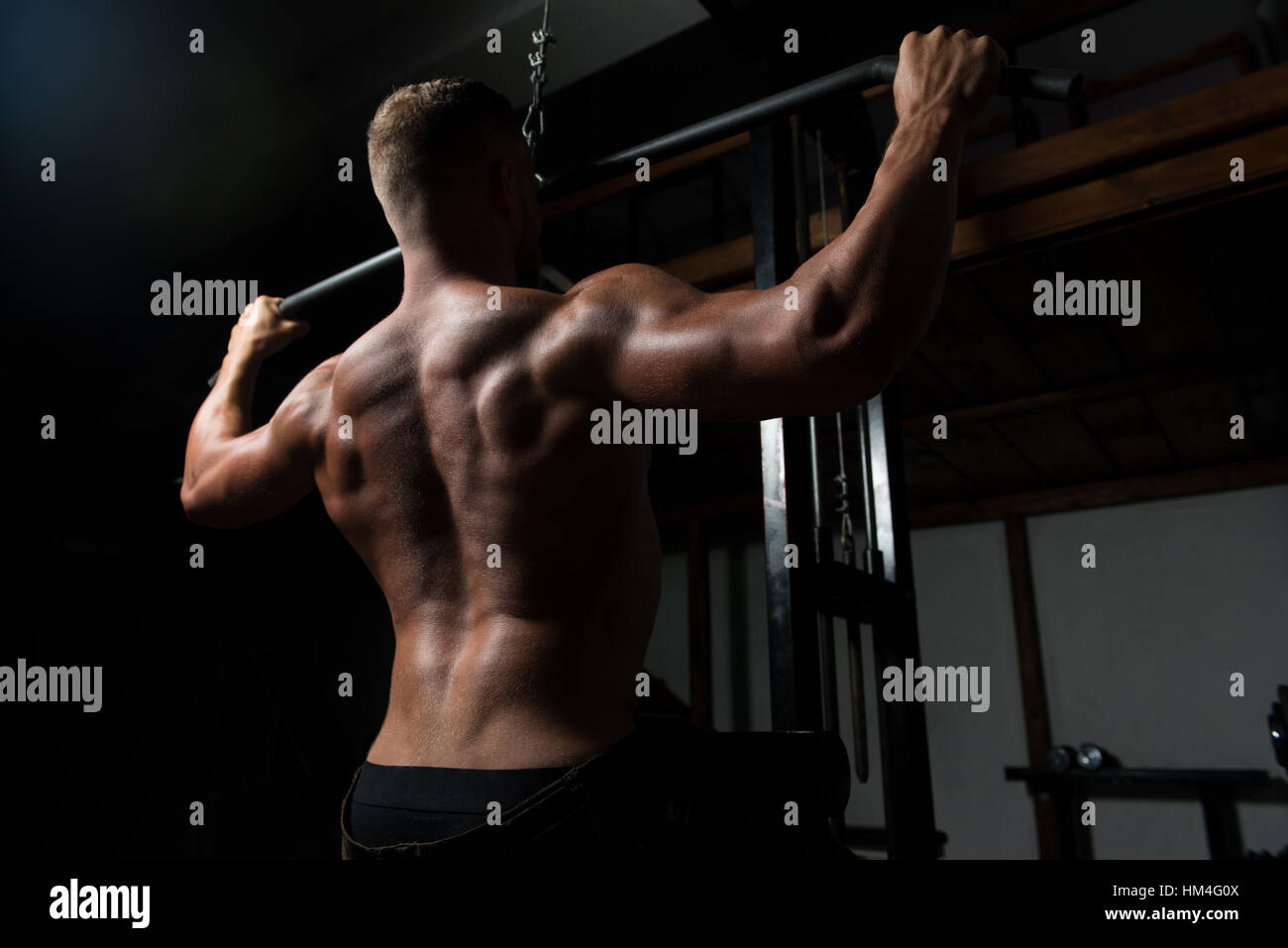 Muscular Athletic Bodybuilder Fitness Model Doing Heavy Weight Exercise ...