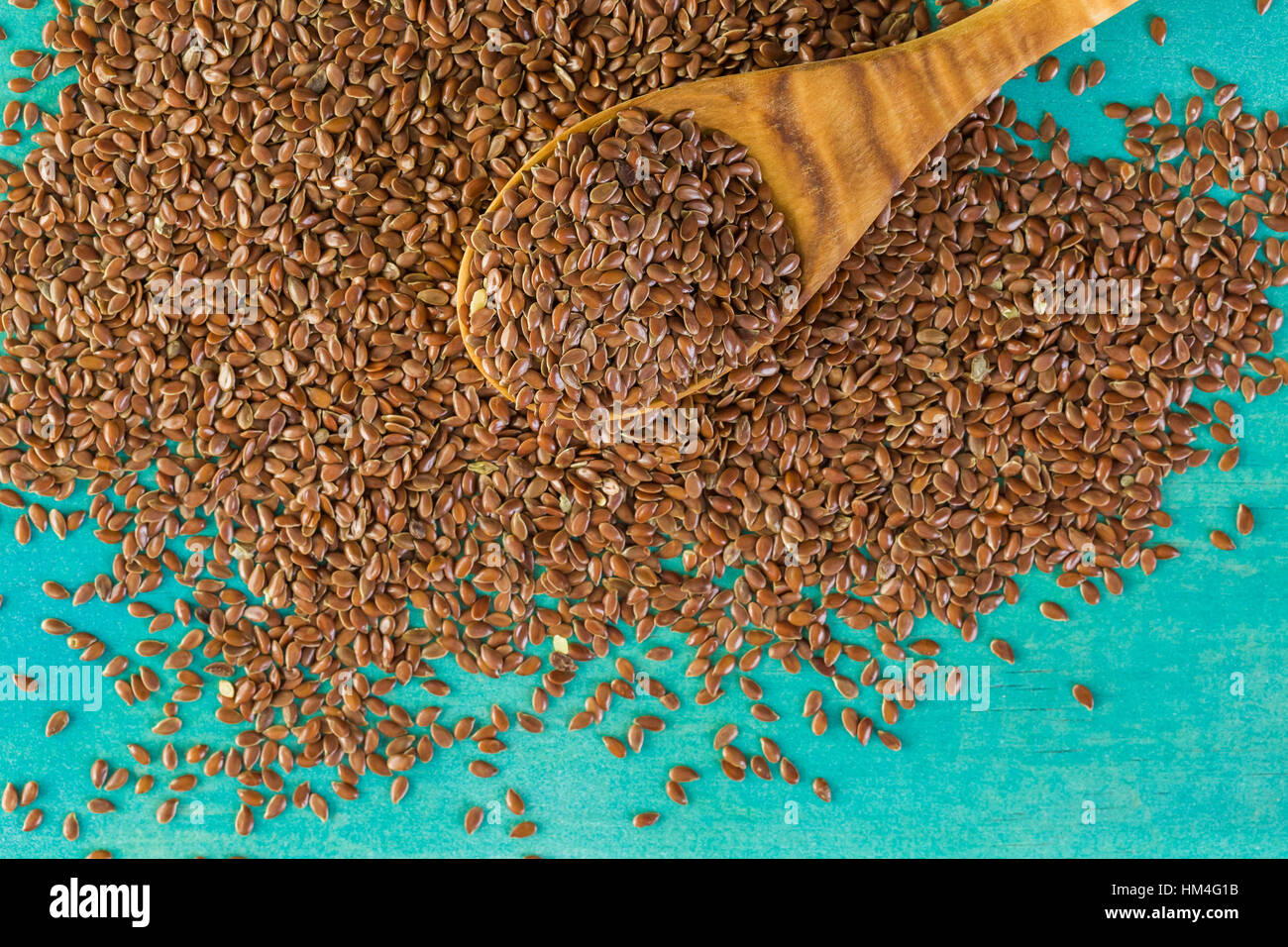 Flax seeds on painted wood board Stock Photo - Alamy