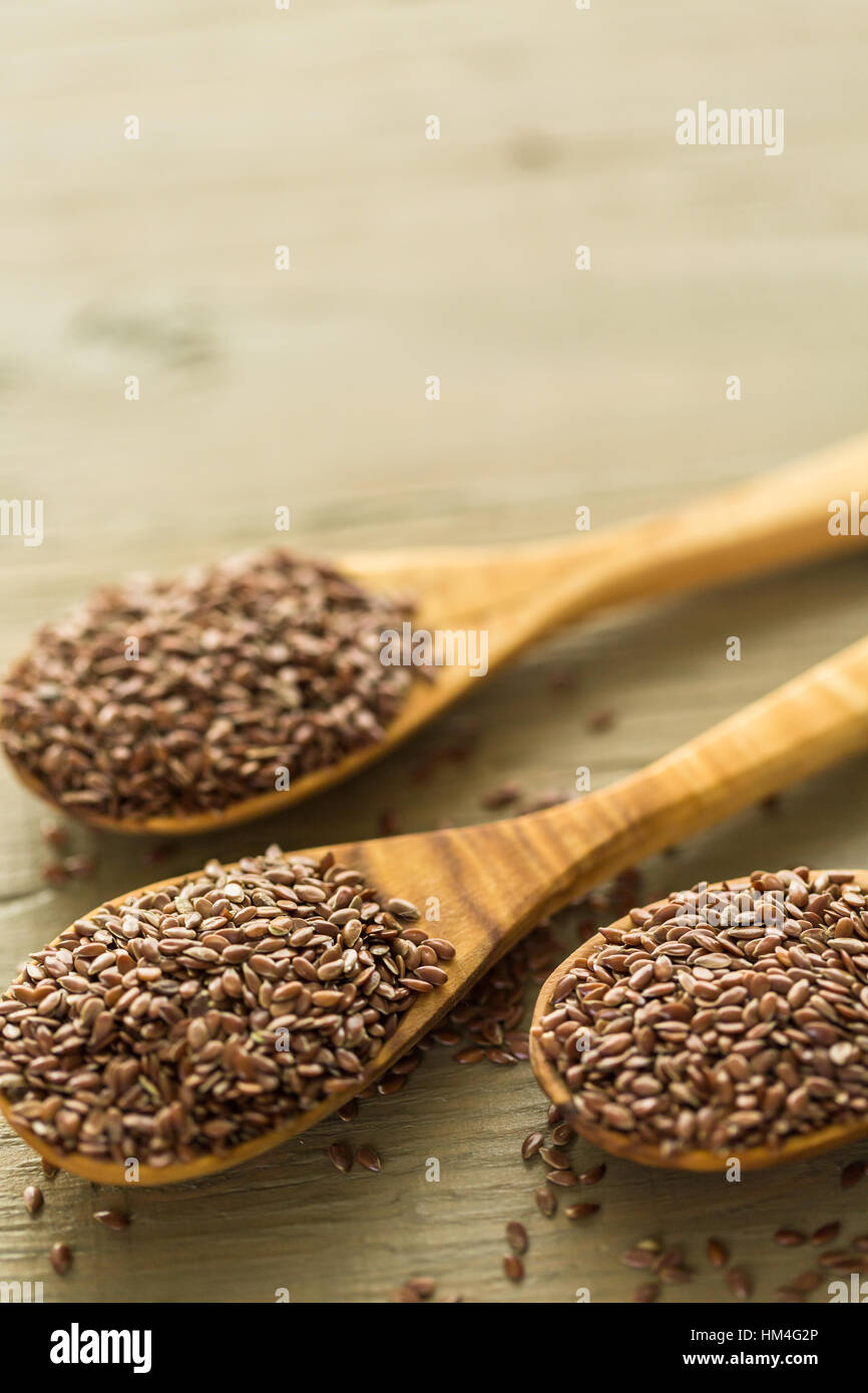 Flax seeds on painted wood board Stock Photo - Alamy