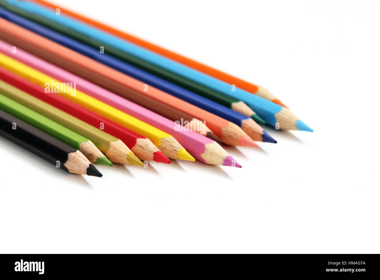 Close up of color pencils against white background Stock Photo - Alamy