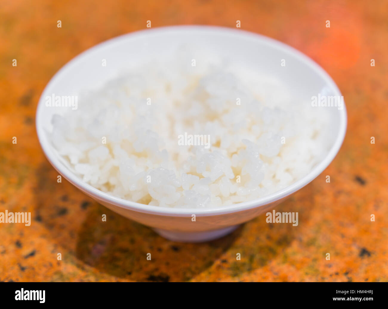 Steamed white rice in cup on table Stock Photo - Alamy