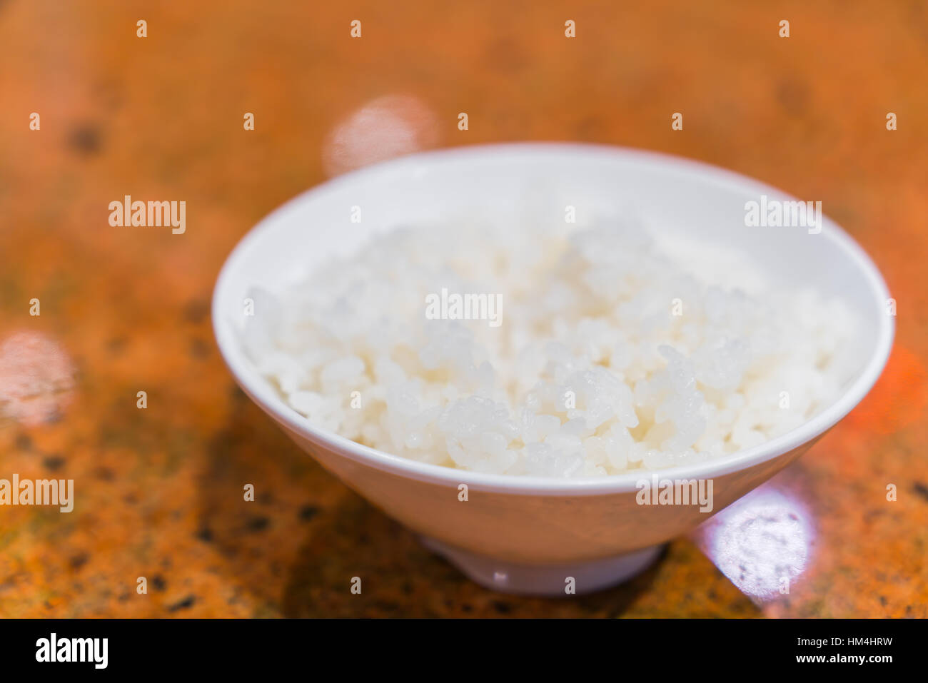 Steamed white rice in cup on table Stock Photo - Alamy