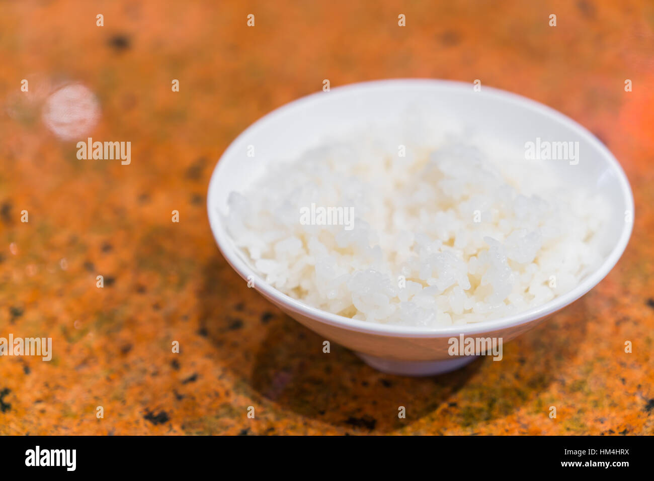 Steamed white rice in cup on table Stock Photo - Alamy