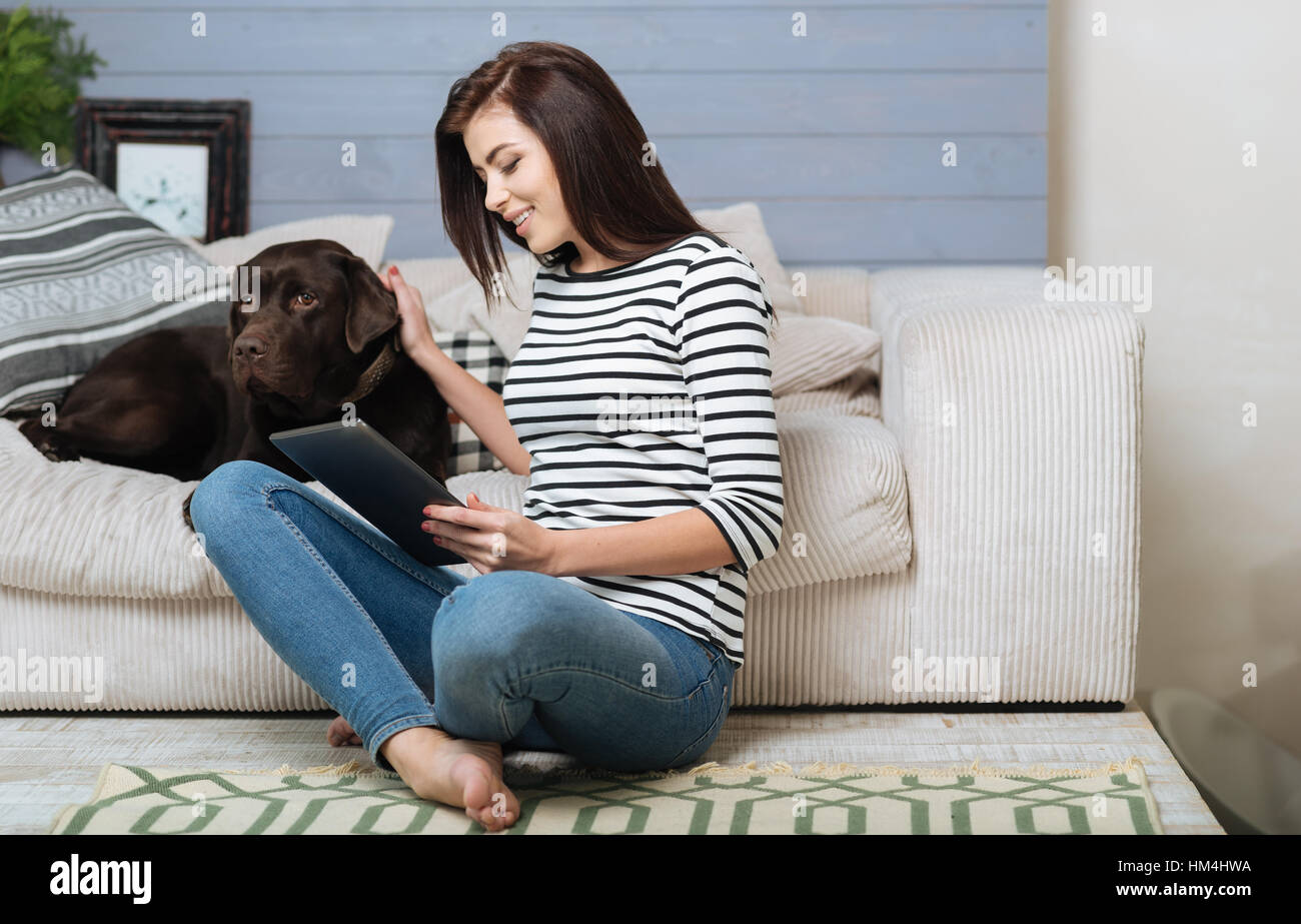 Reading a book with her labrador hi-res stock photography and images ...