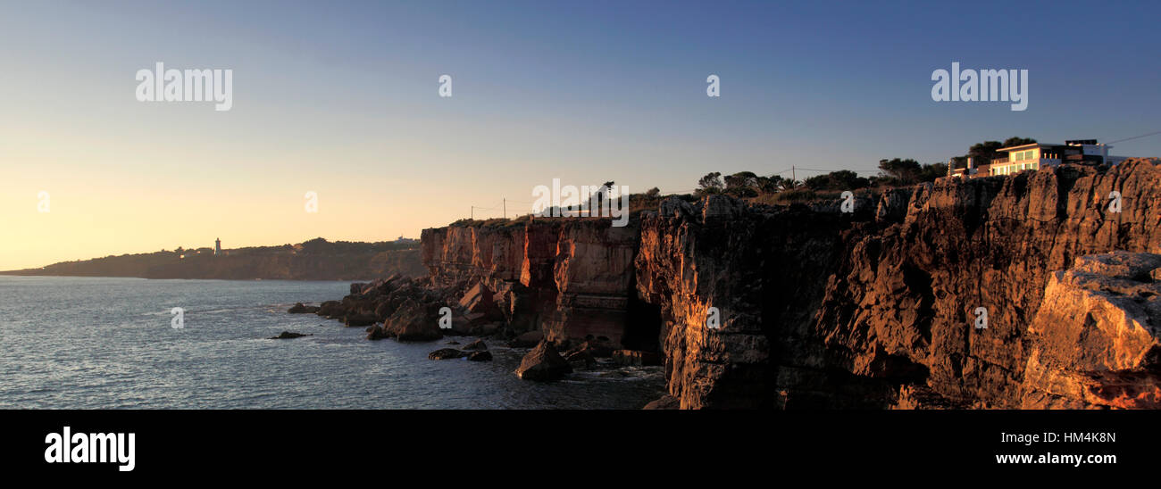 People watching the sunset over the Atlantic Ocean at Boca do Inferno ...