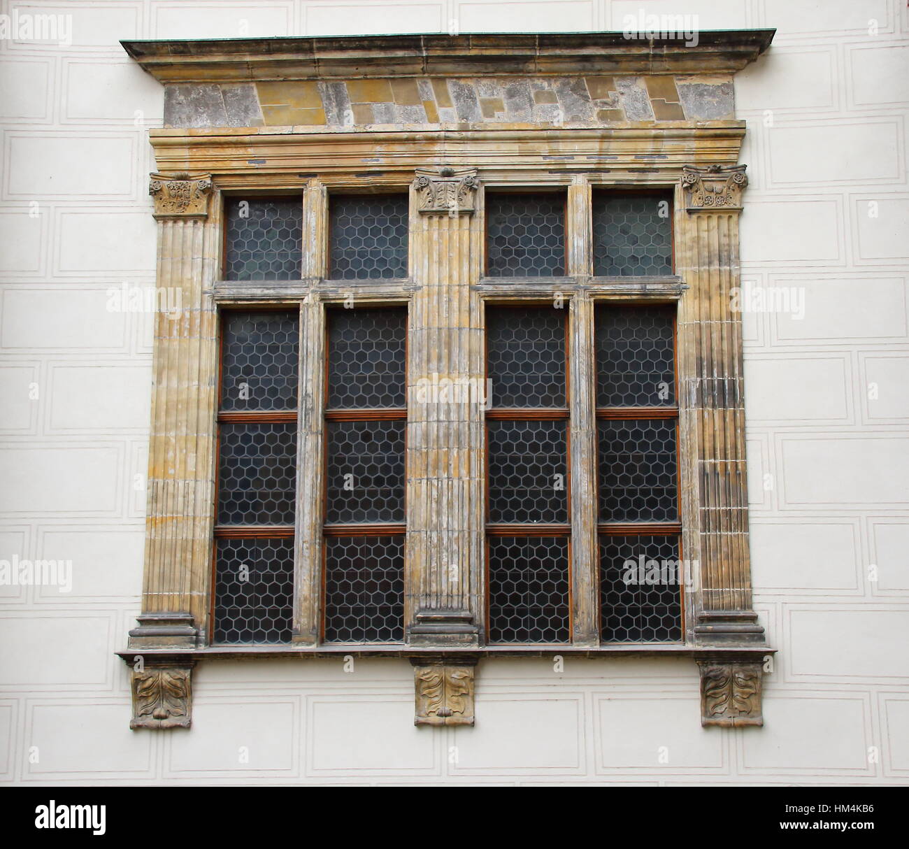 An ornate window in a white wall image with copy space in landscape ...
