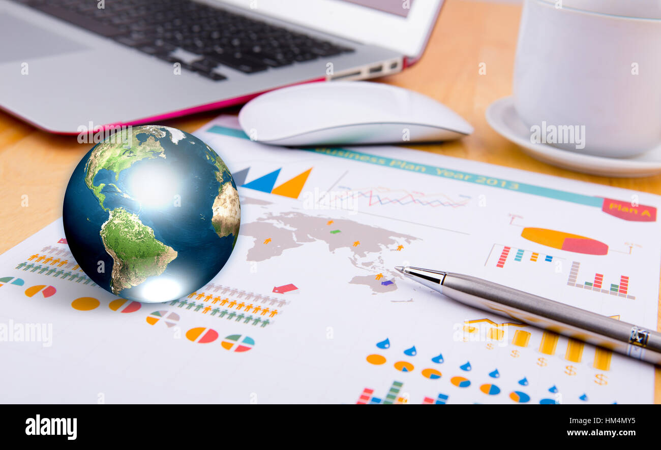 Financial chart on the table with laptop, coffee and pen (Elements of ...
