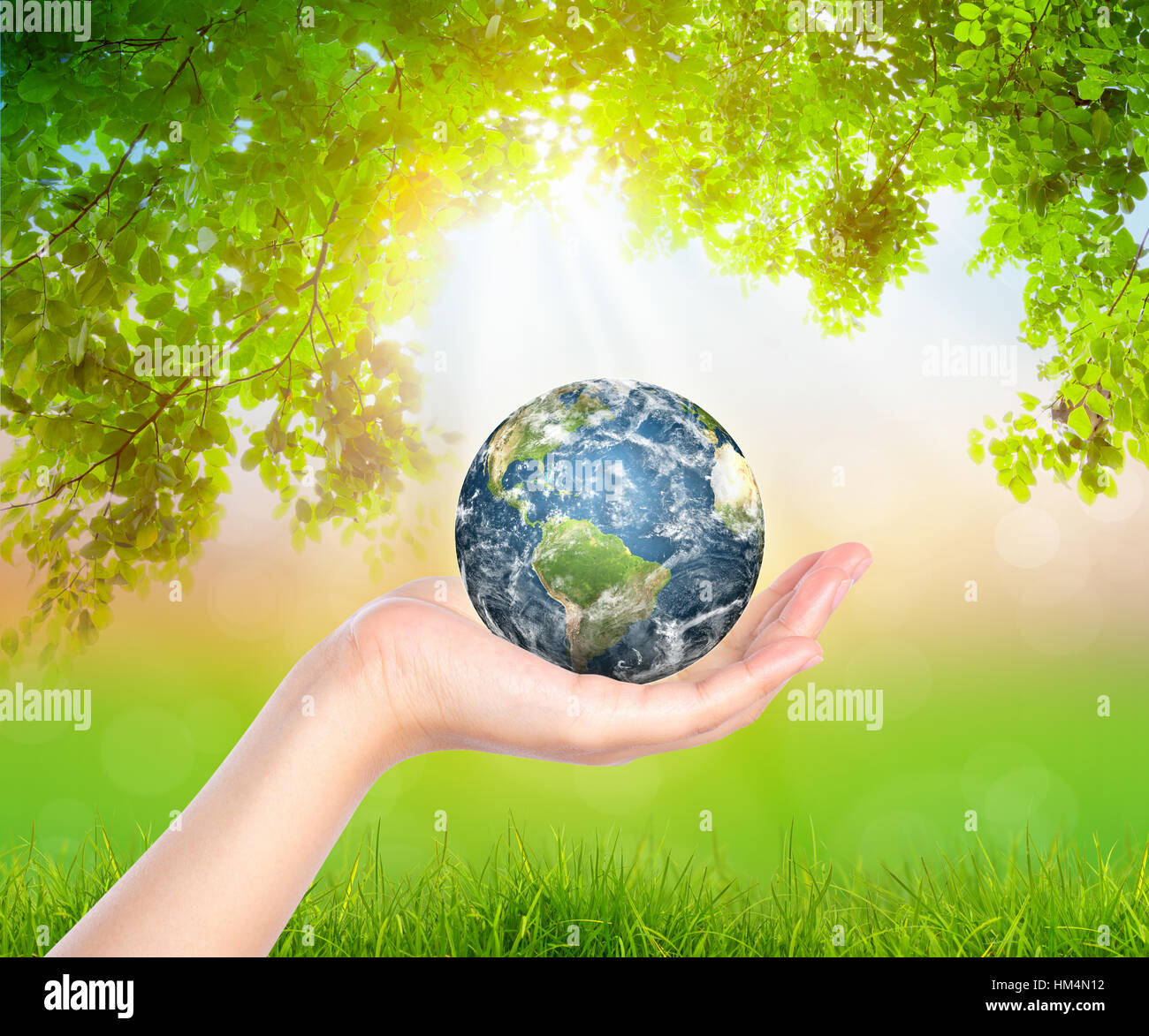 Hands with earth (Elements of this image furnished by NASA Stock Photo ...