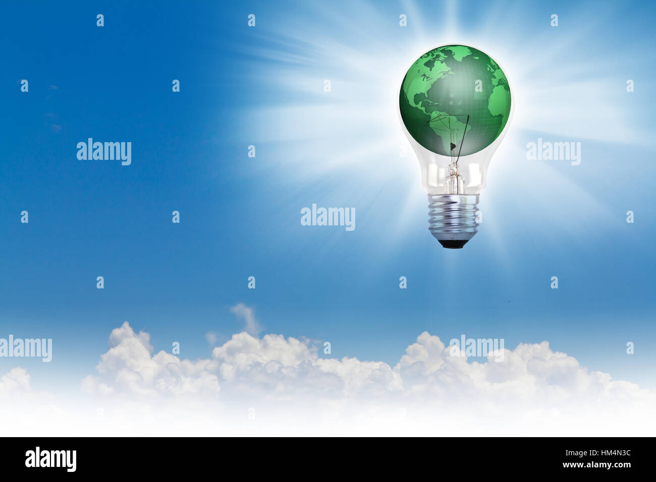 Green earth in bulb over blue sky Stock Photo - Alamy