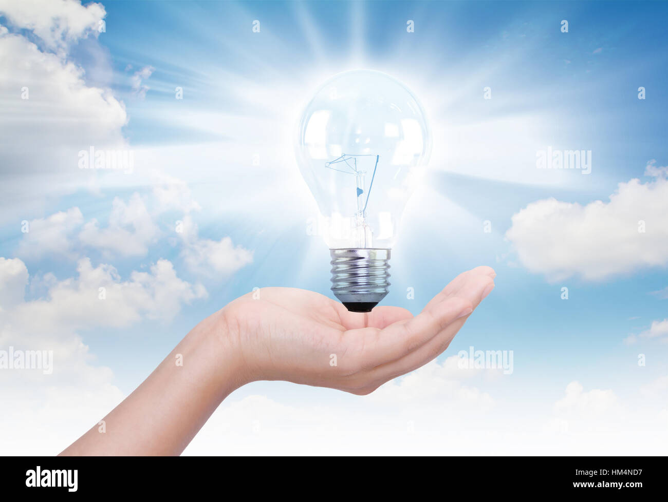 Light bulb in hand Stock Photo - Alamy
