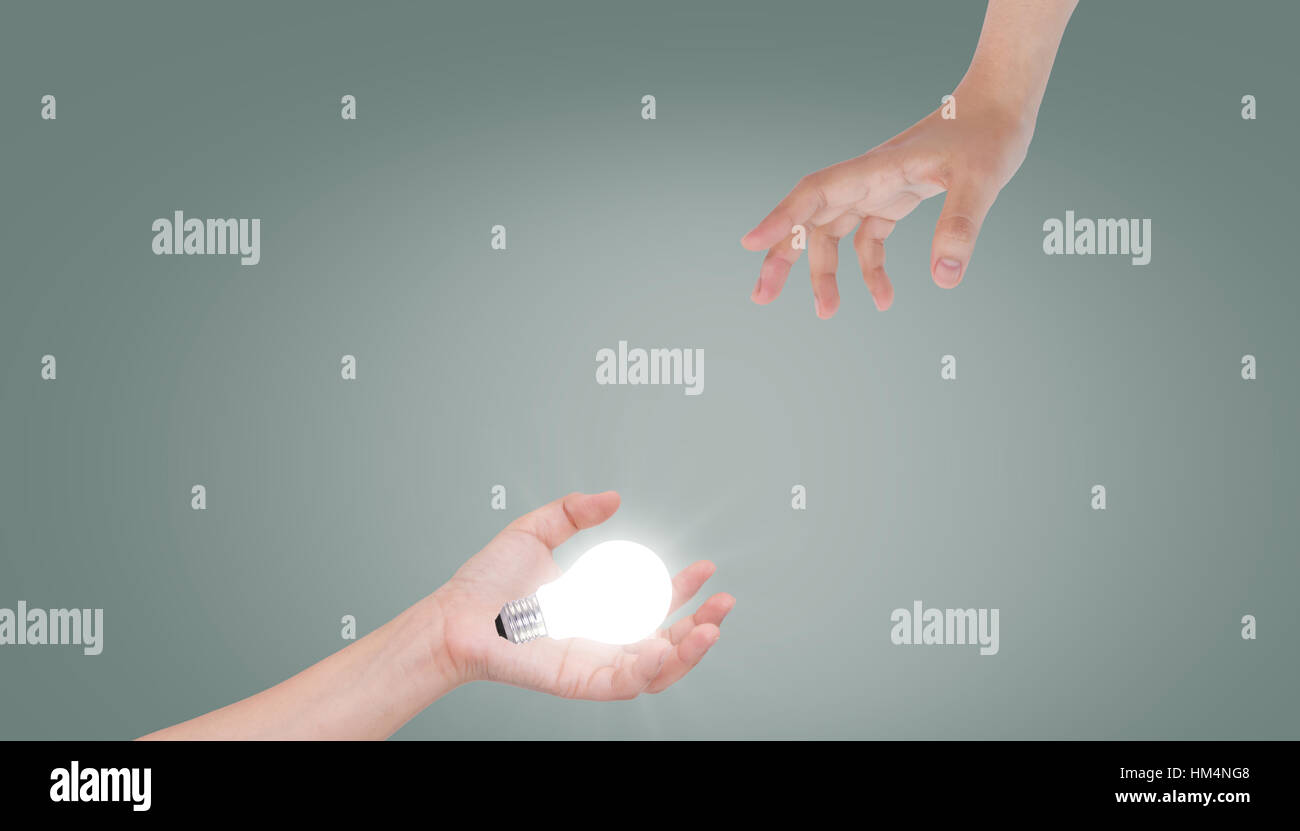 Women hand with lamp bulb Stock Photo - Alamy