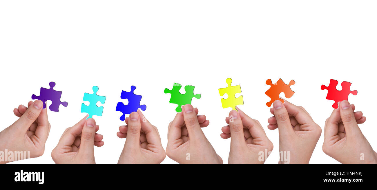 Hands and puzzle Stock Photo - Alamy