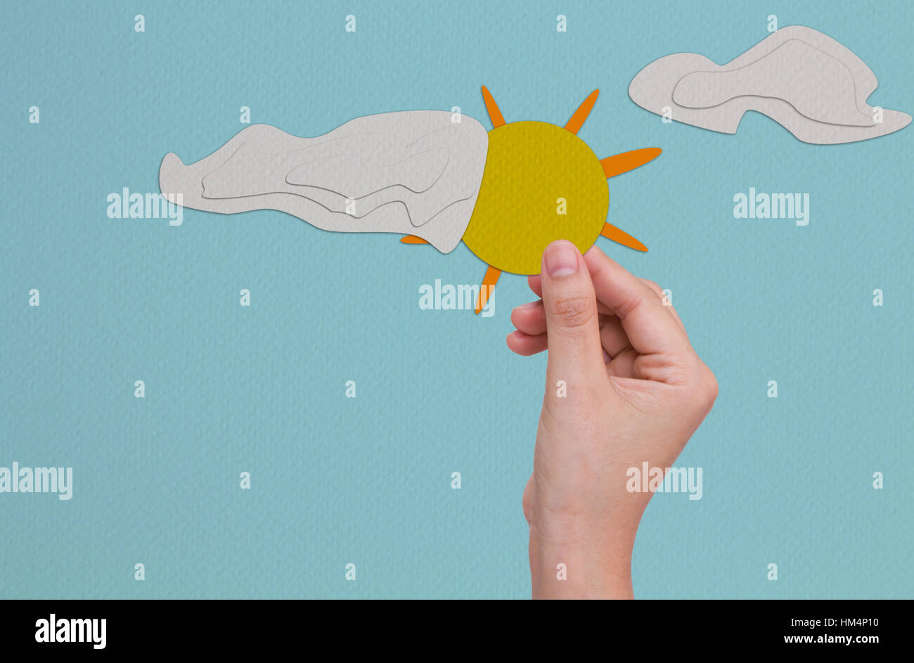 Hand pick paper craft of sun Stock Photo - Alamy