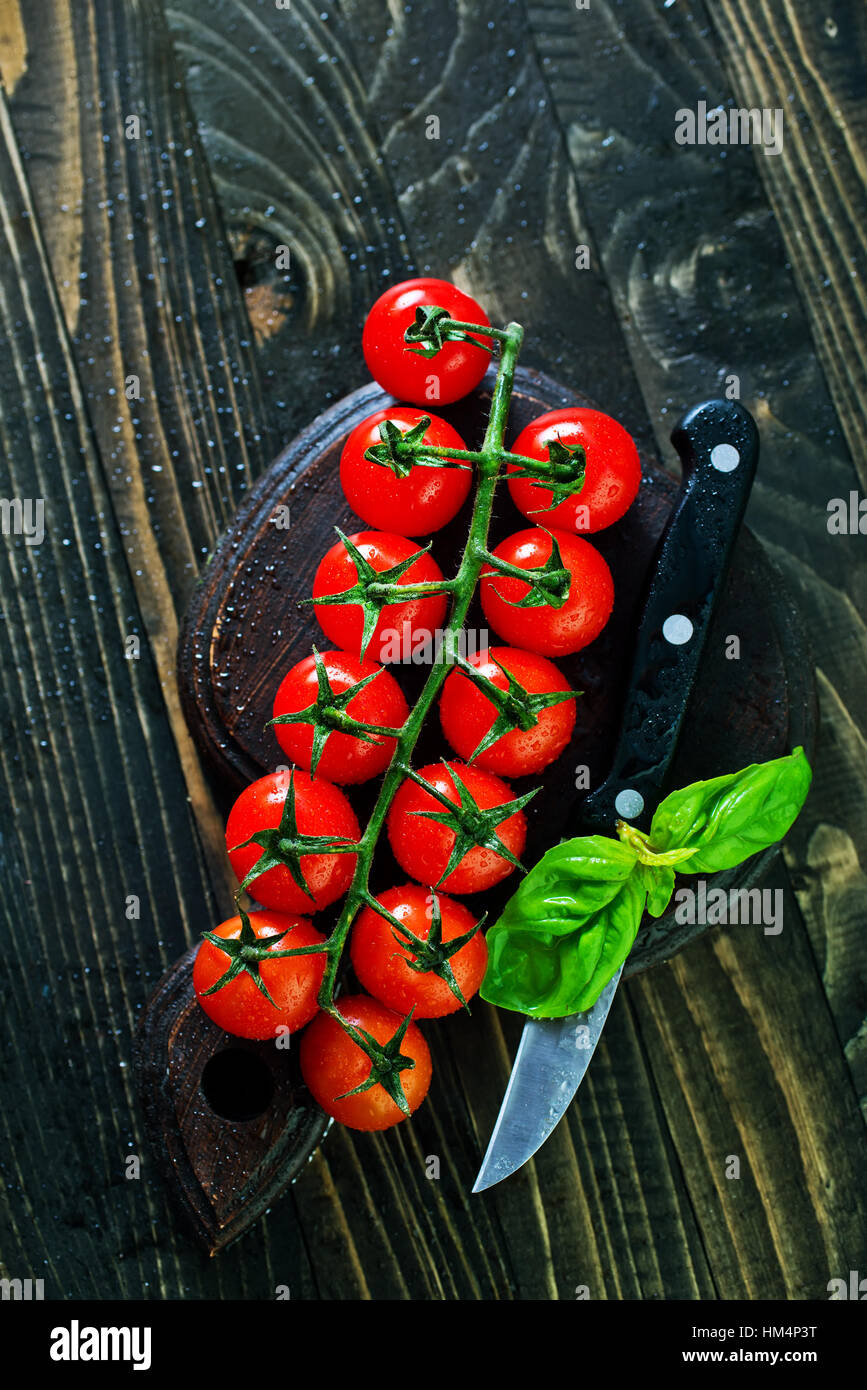 fresh tomato, cherry tomato on a table Stock Photo - Alamy