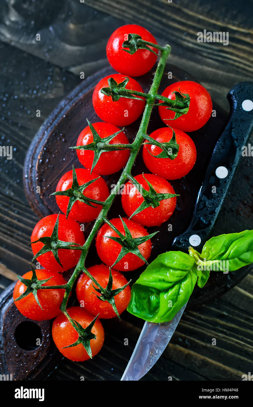 fresh tomato, cherry tomato on a table Stock Photo - Alamy