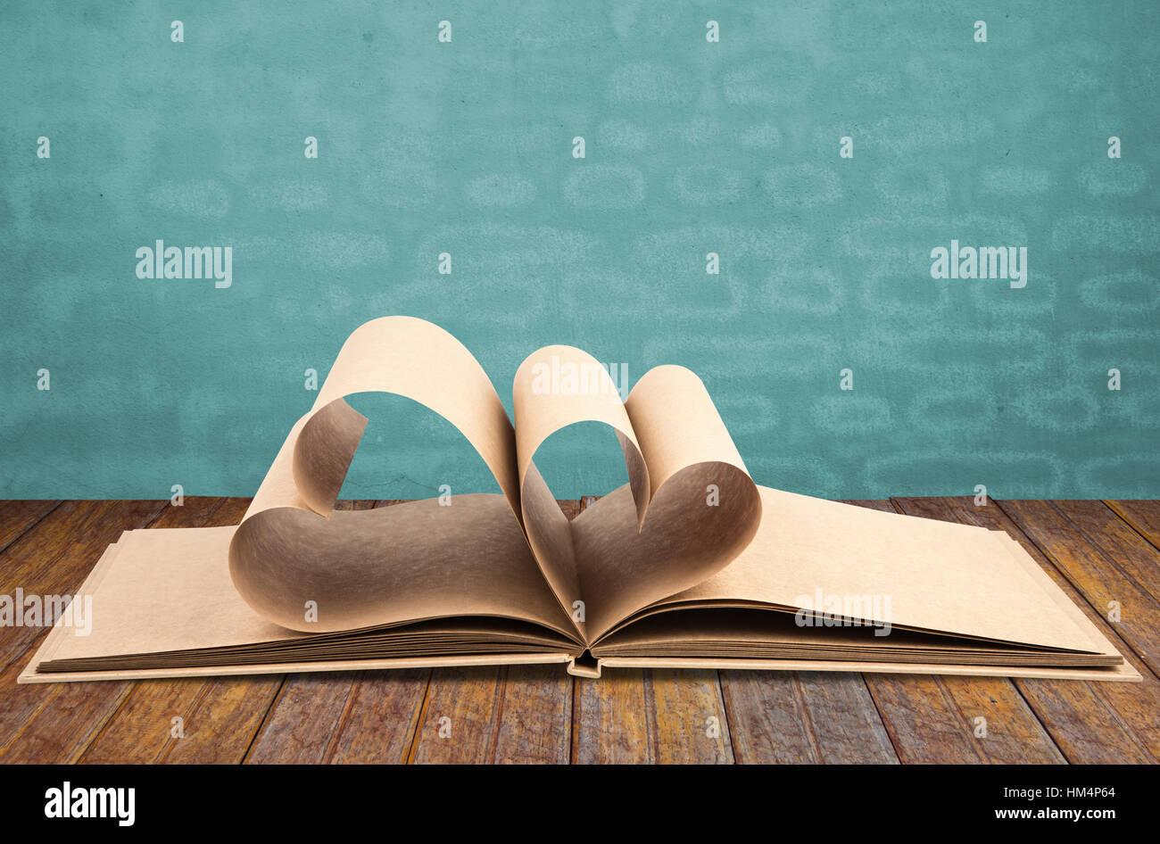 Book with opened pages of shape of heart Stock Photo - Alamy