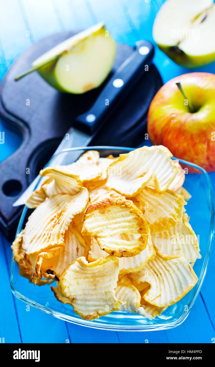 apple chips in bowl and on a table Stock Photo - Alamy