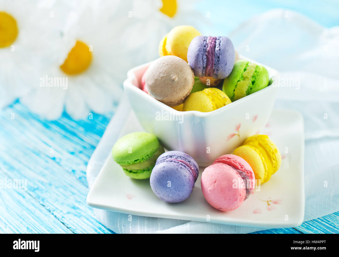 color macaroons in bowl and on a table Stock Photo - Alamy