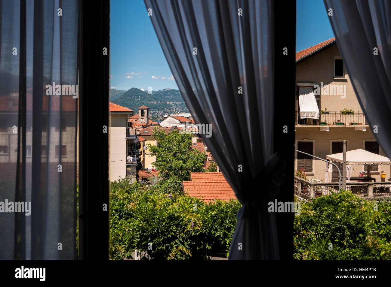 Town and nature behind window Stock Photo - Alamy