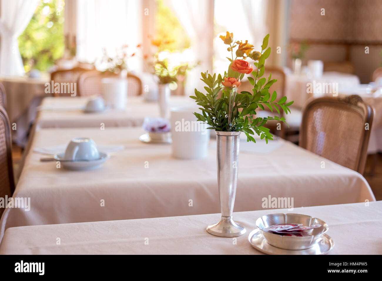 Vase with flowers on table Stock Photo - Alamy