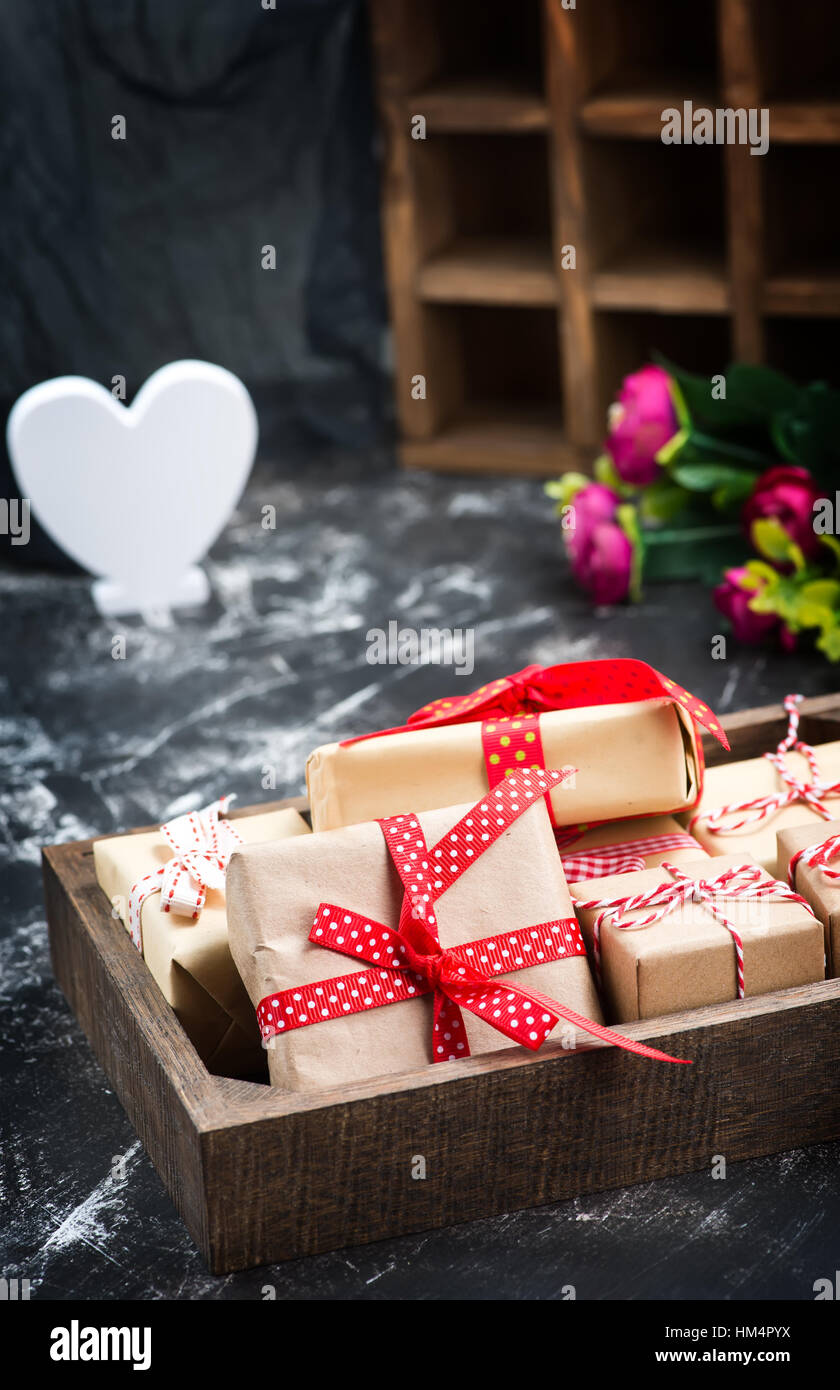 heart and boxes for present on a table Stock Photo - Alamy