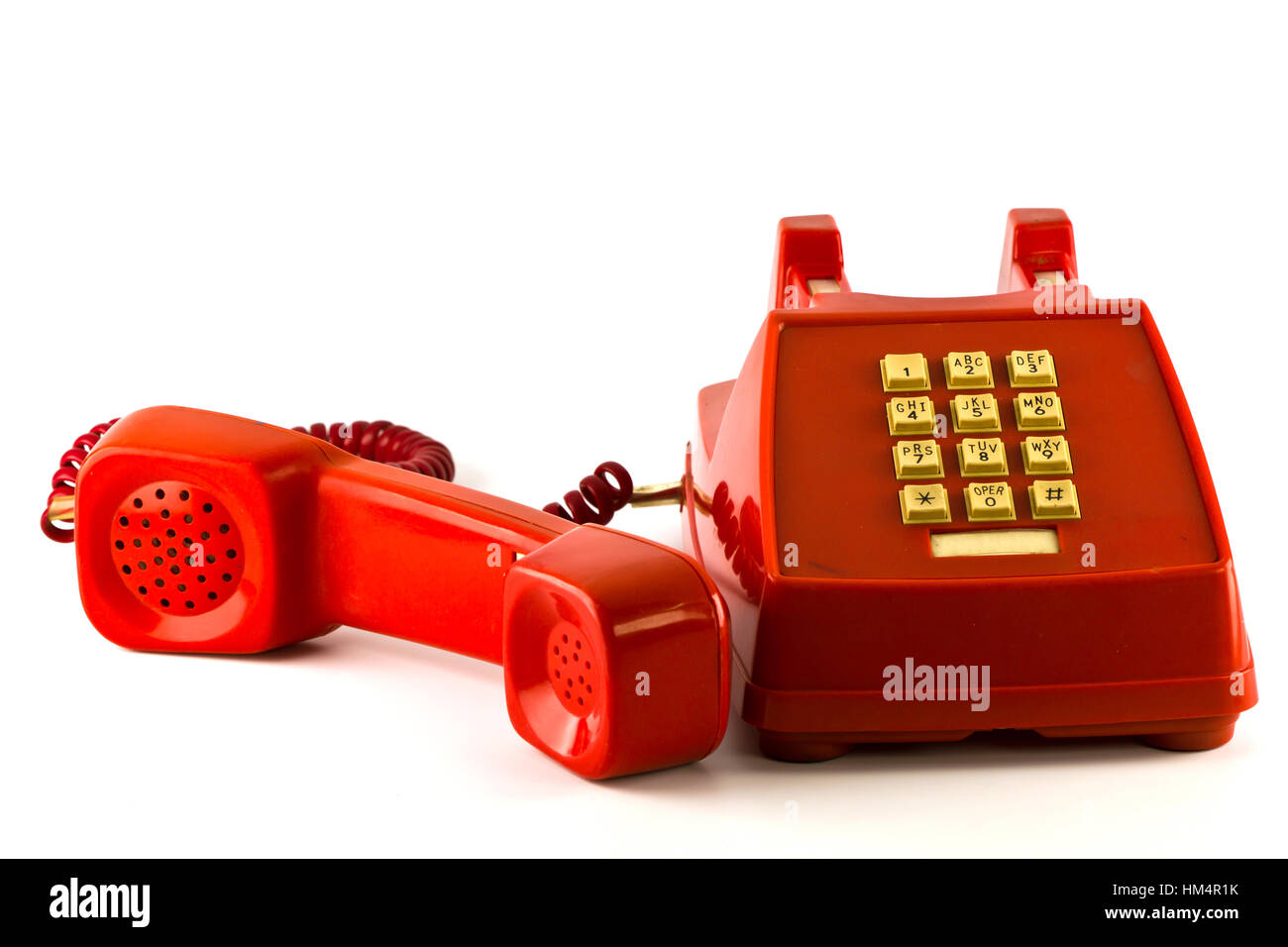 Old red phone isolated on white background Stock Photo - Alamy