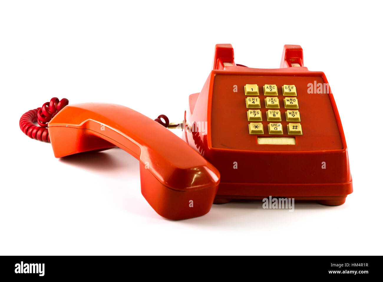 Old red phone isolated on white background Stock Photo - Alamy