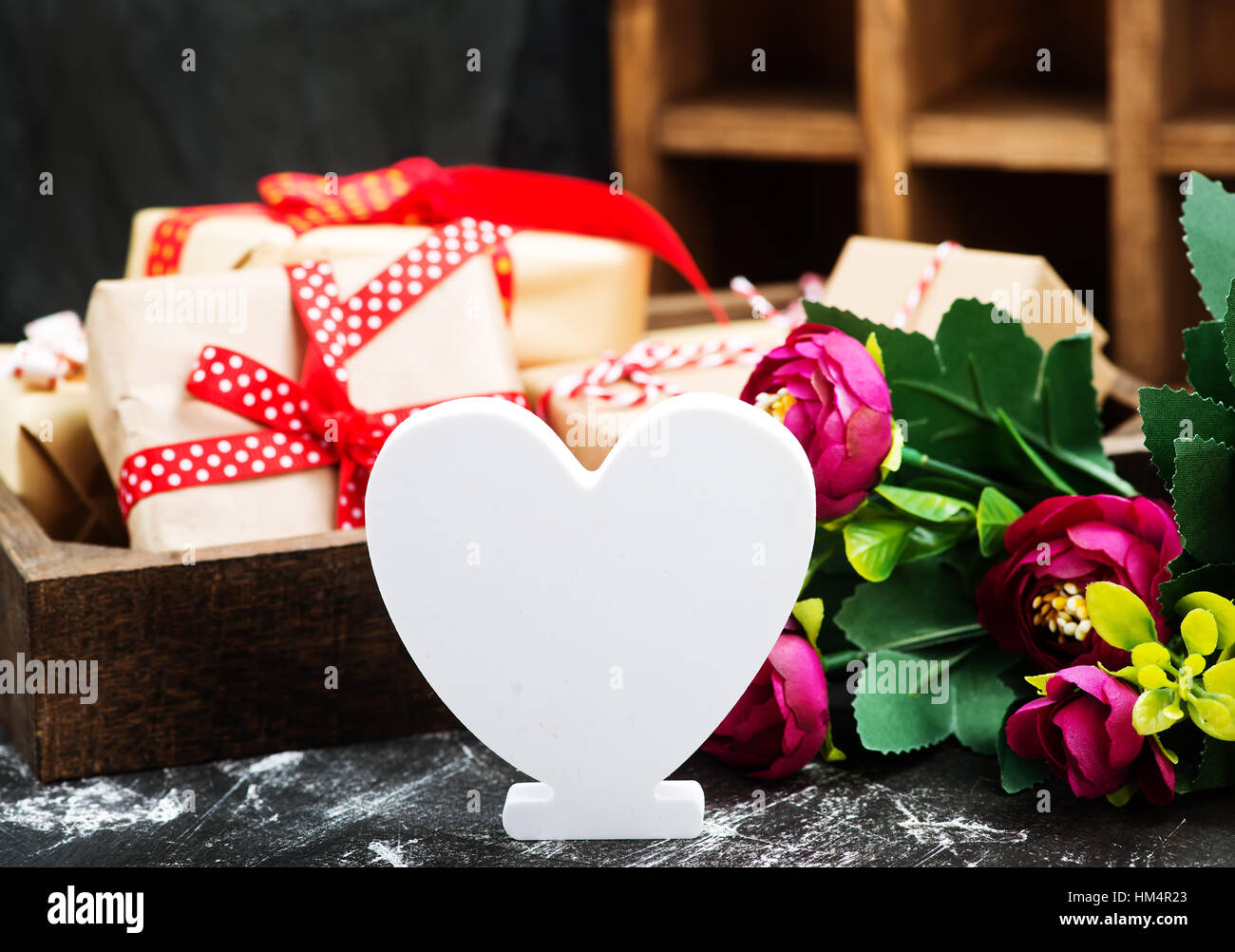heart and boxes for present on a table Stock Photo - Alamy