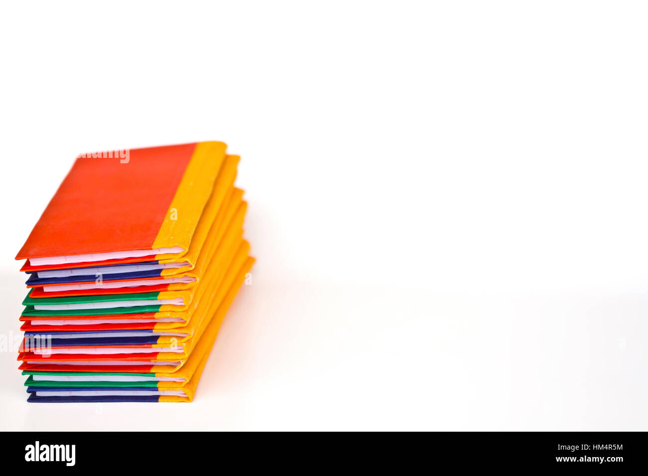 Stack of colorful books on white background, side view Stock Photo - Alamy