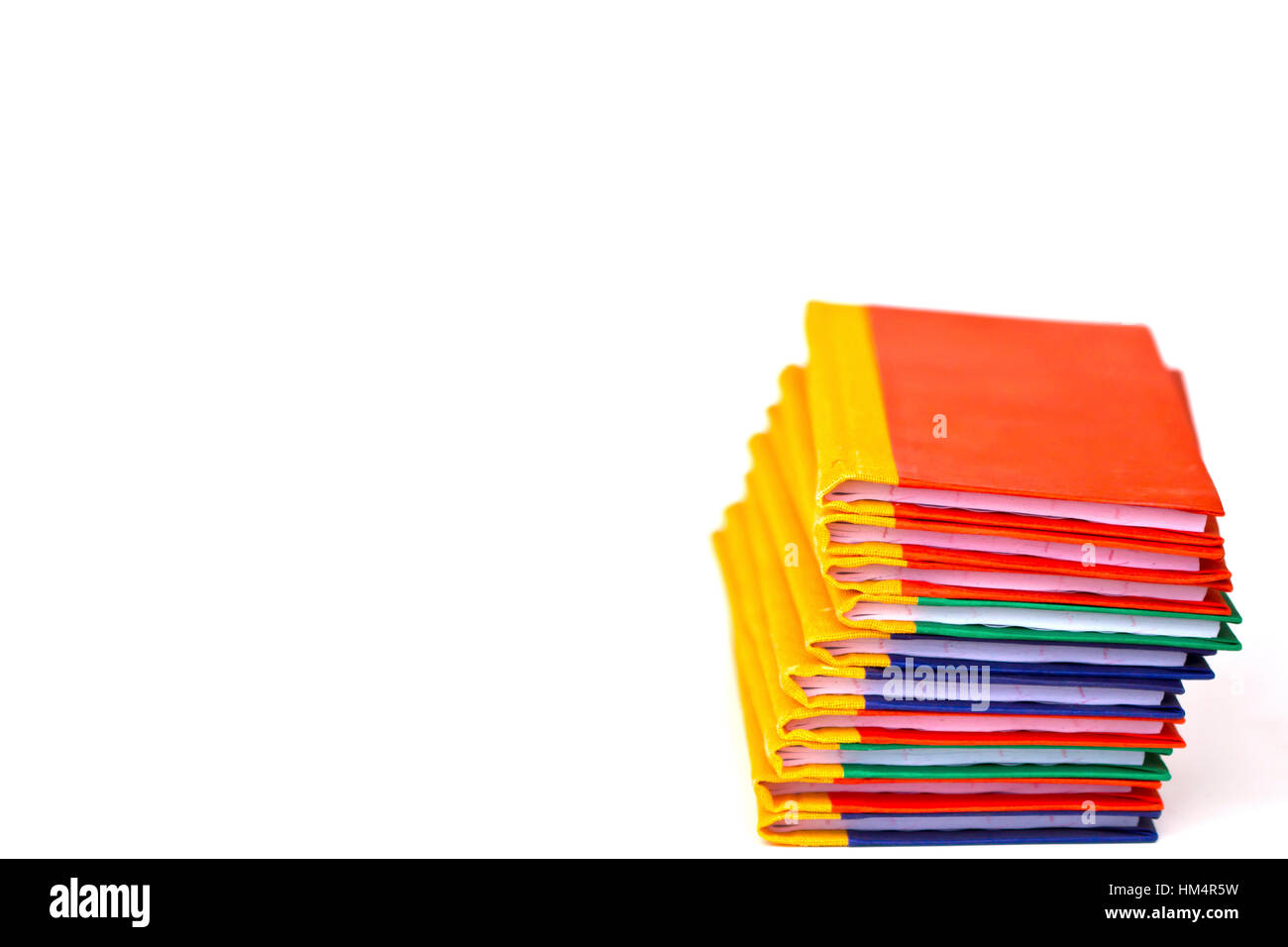 Stack of colorful books on white background, partial view Stock Photo ...