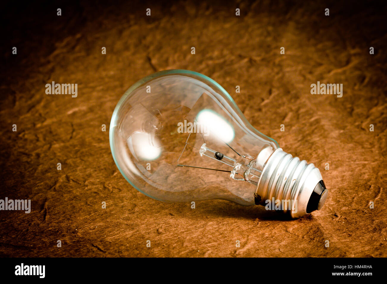 light bulb on the brown background Stock Photo - Alamy