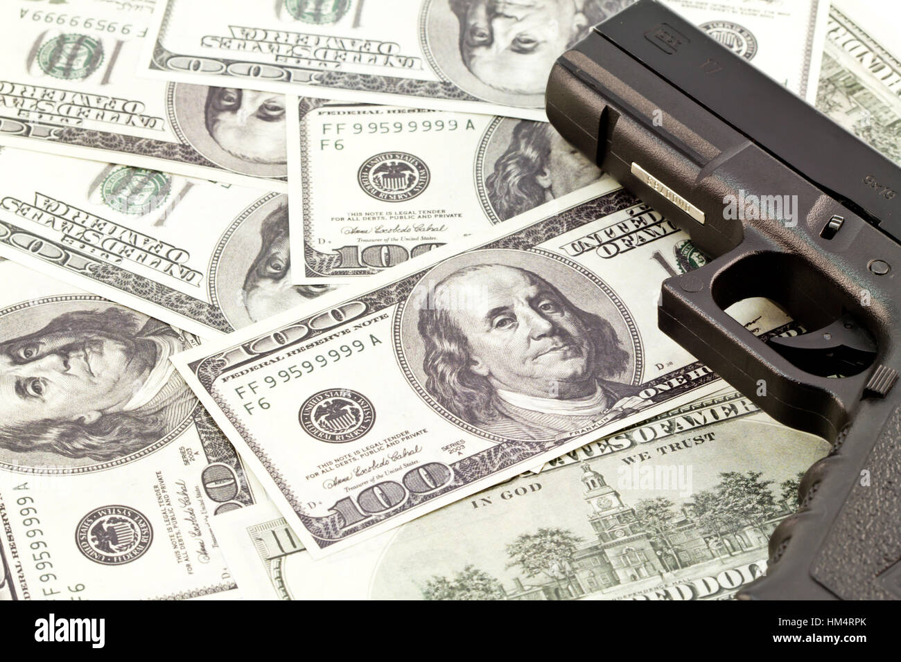close up image of pistol and dollar Stock Photo - Alamy