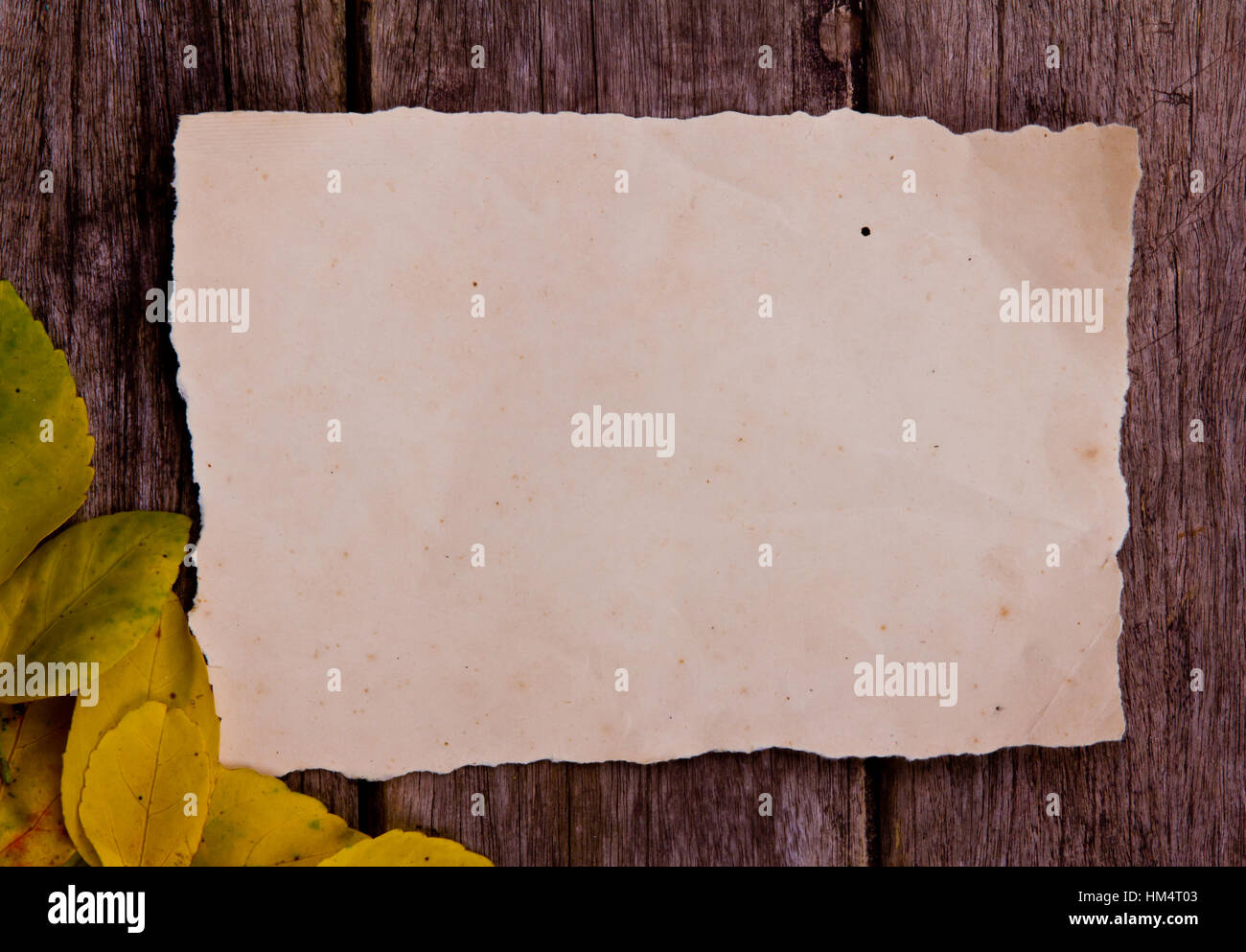 Old paper on brown wood Stock Photo - Alamy