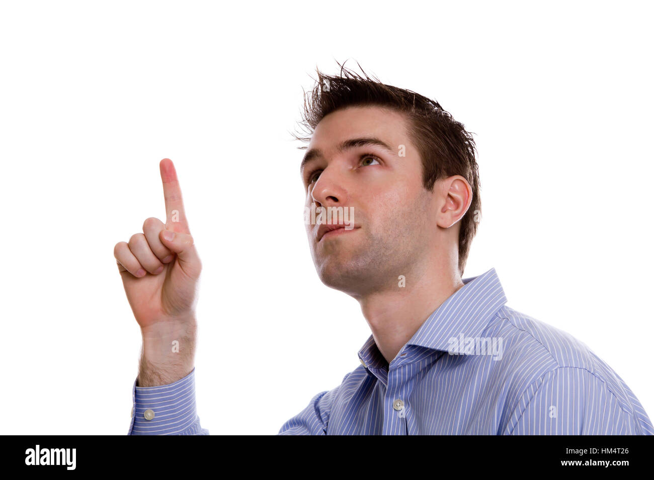 Portrait of young business man point up against white background Stock ...