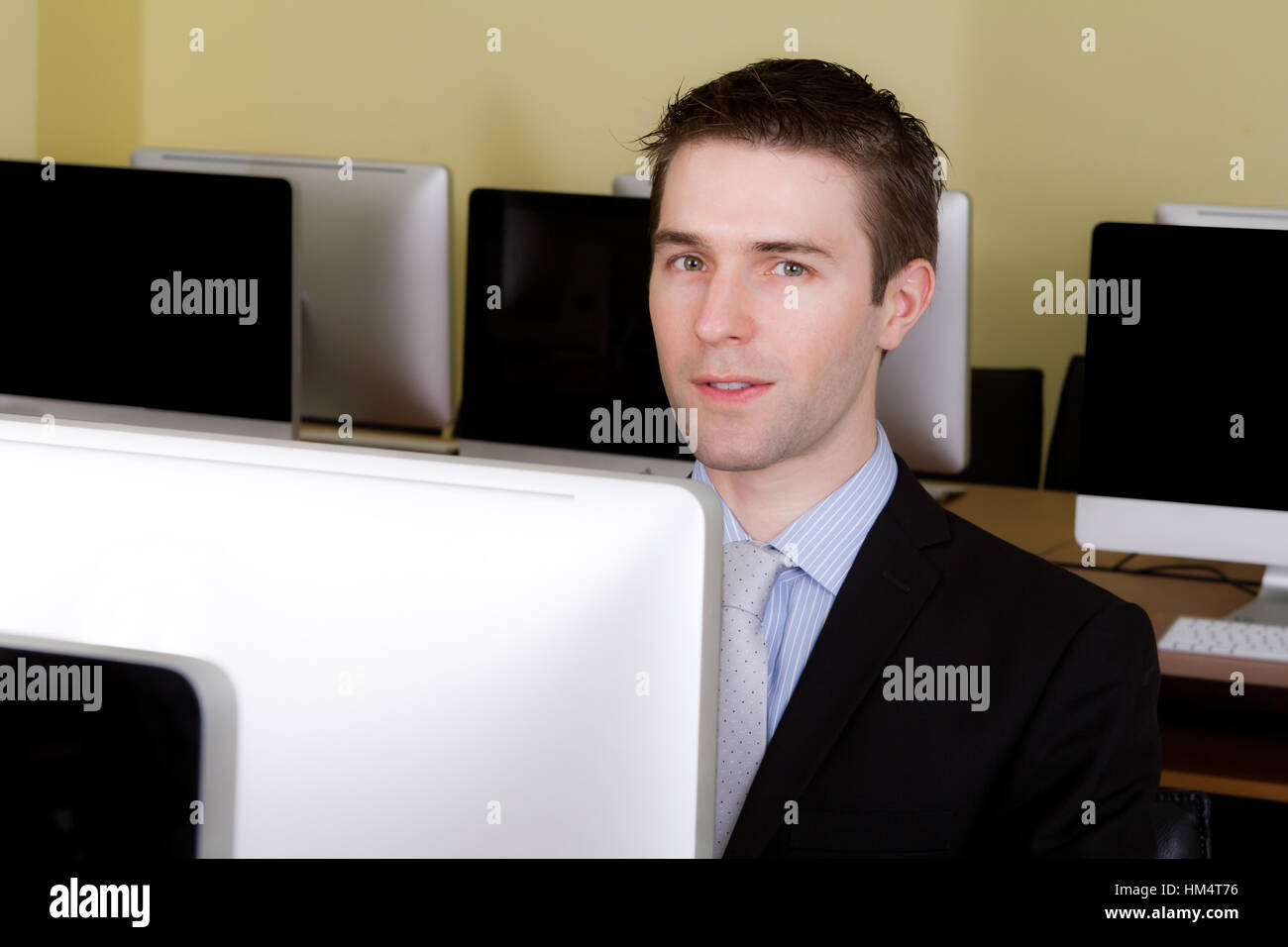 Business man at workplaces in computer room Stock Photo - Alamy