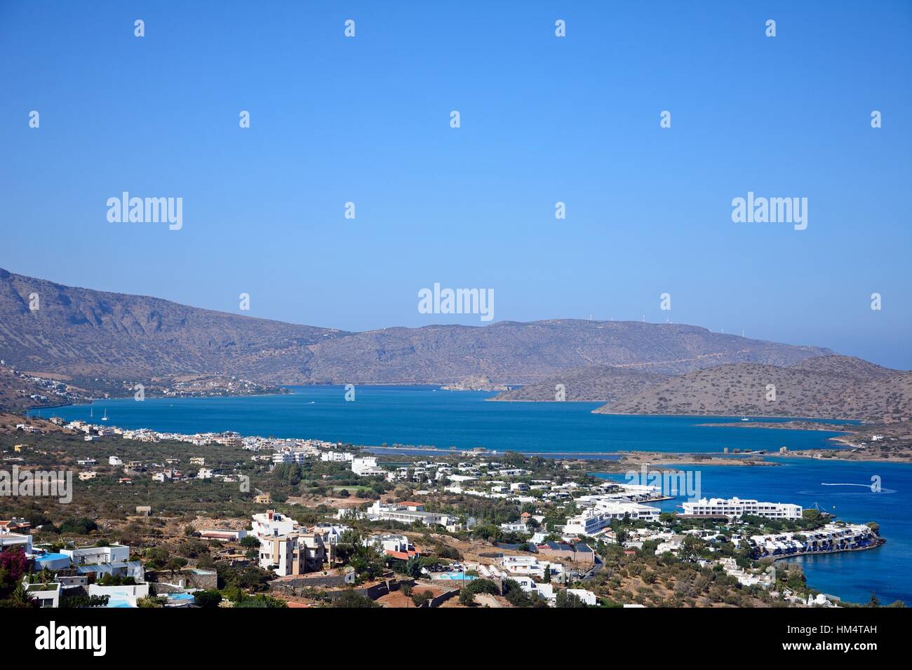 Elevated view of Elounda with views across the sea towards the island ...
