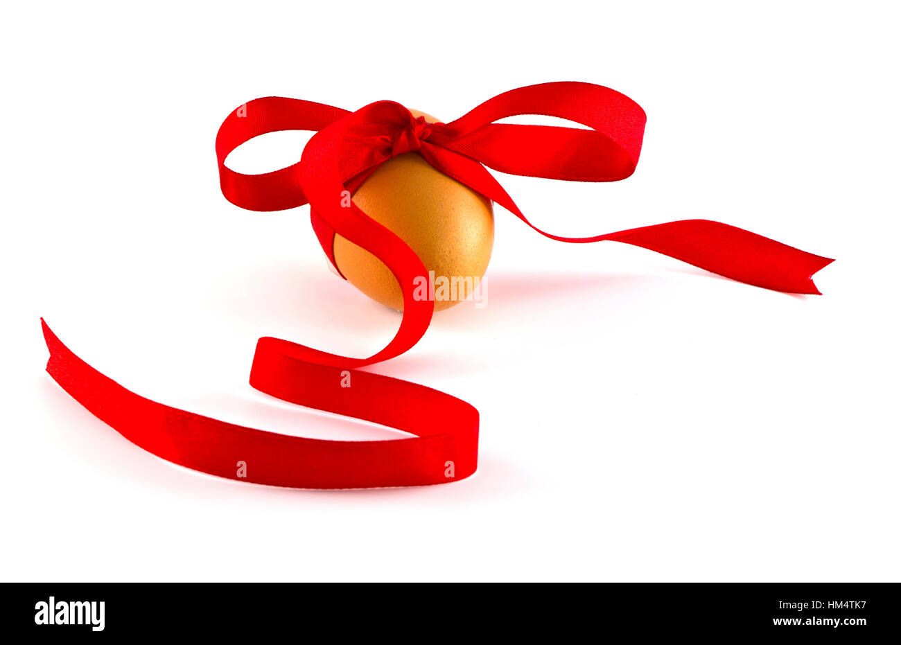Egg with ribbon isolated on white background Stock Photo - Alamy