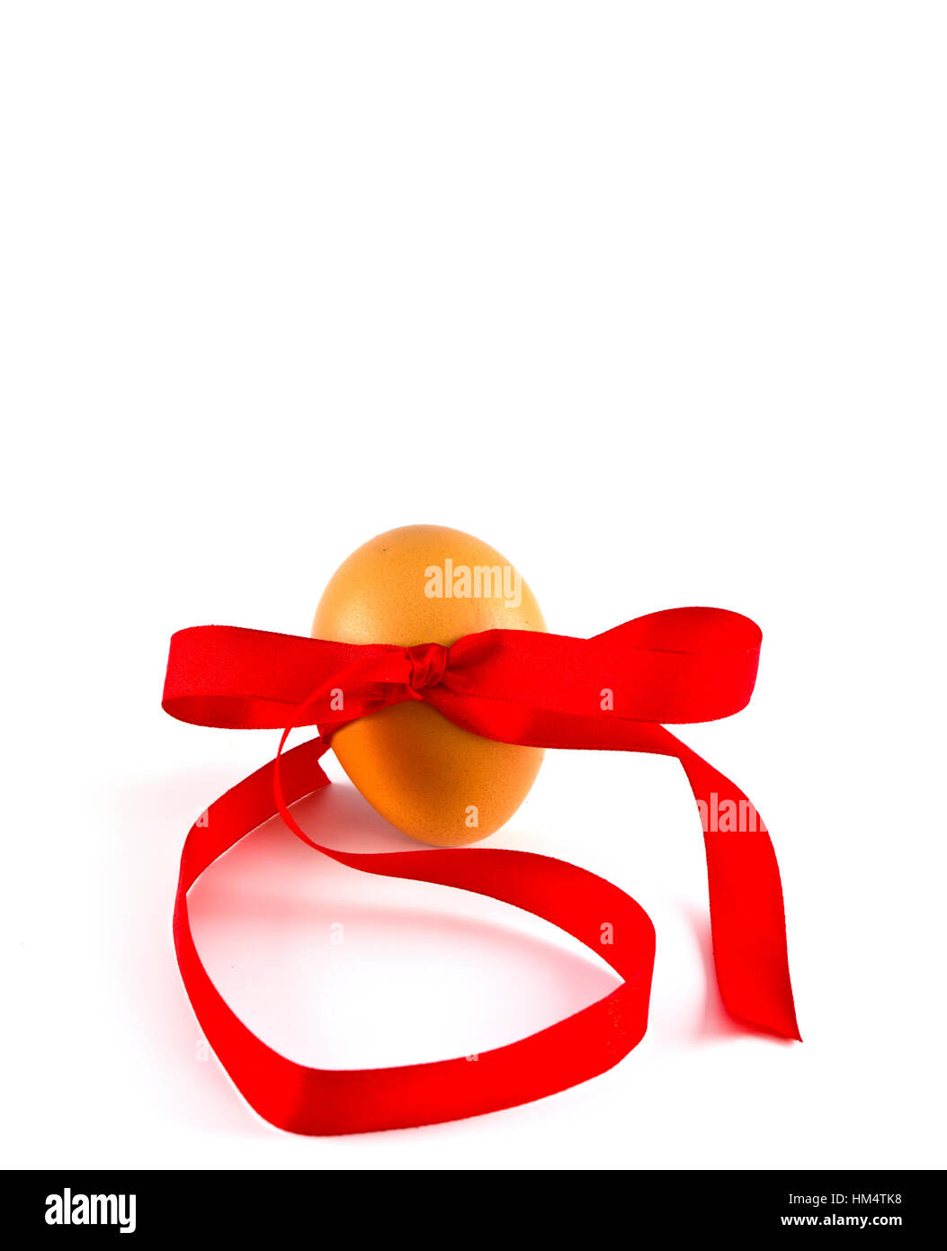 Egg with ribbon isolated on white background Stock Photo - Alamy