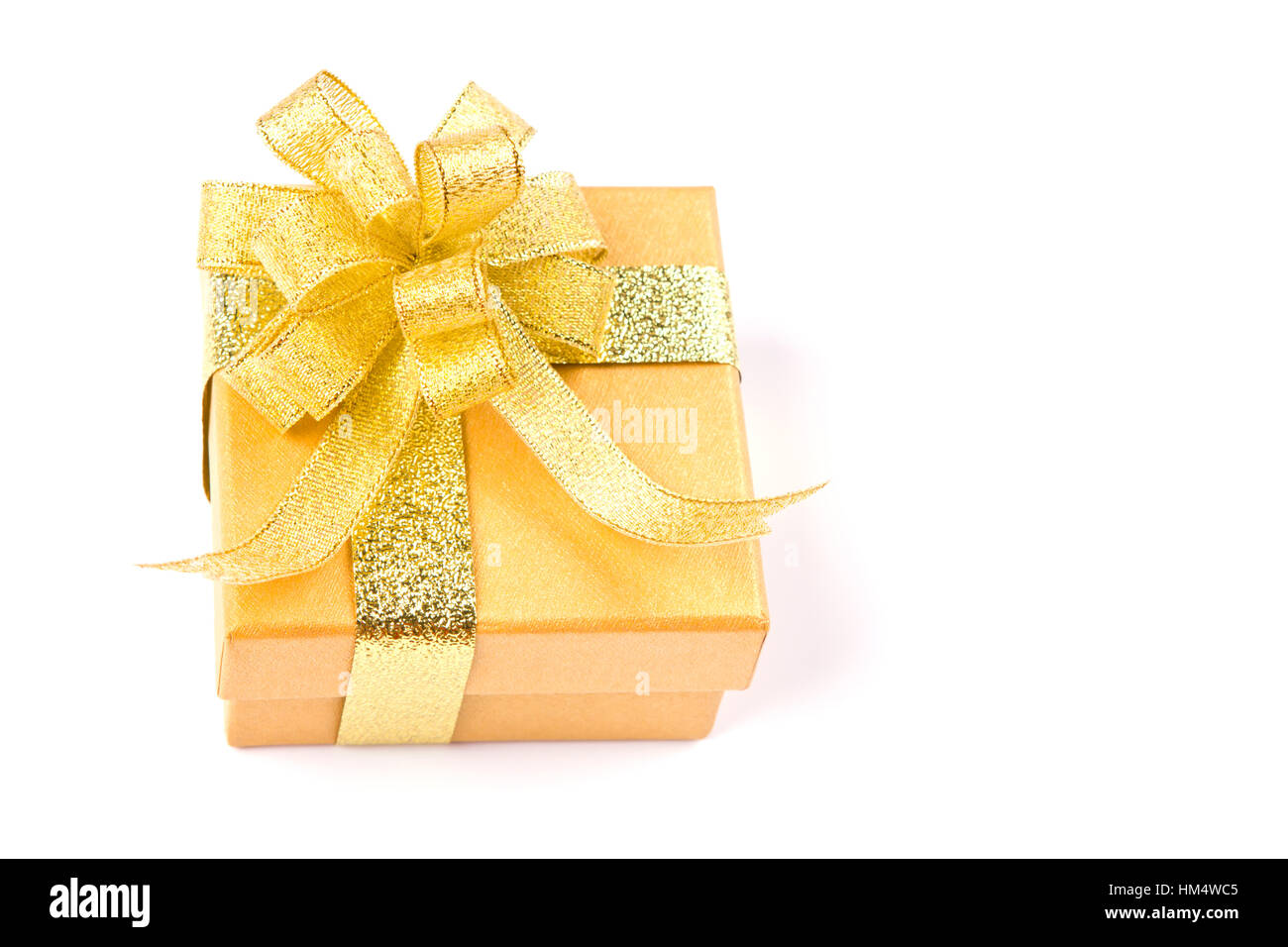 Golden gift box with golden ribbon Stock Photo - Alamy