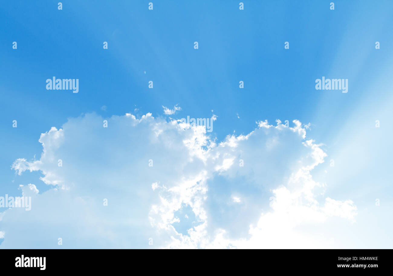 Blue sky with sun and beautiful clouds Stock Photo - Alamy
