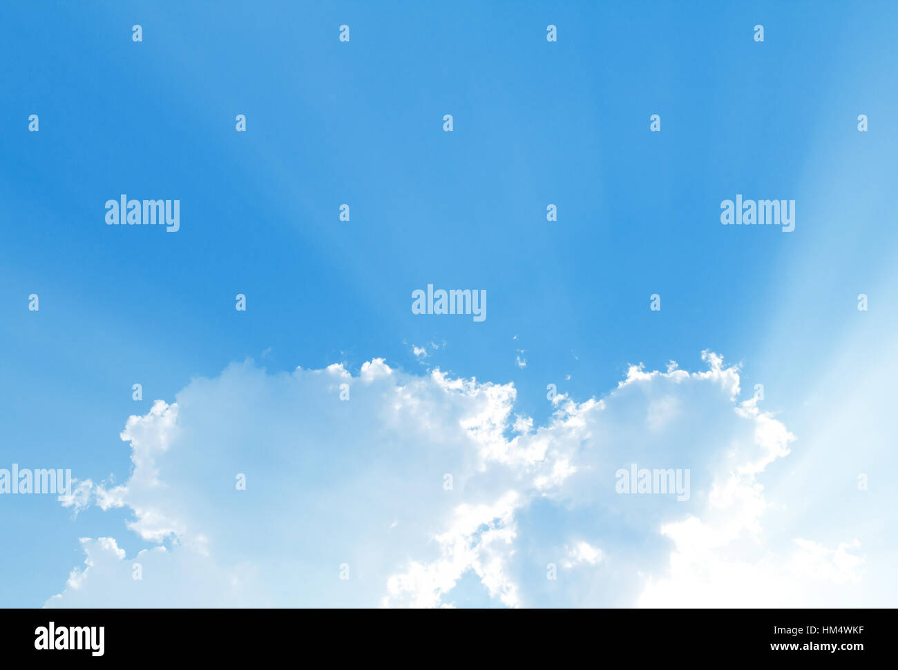 Blue sky with sun and beautiful clouds Stock Photo - Alamy