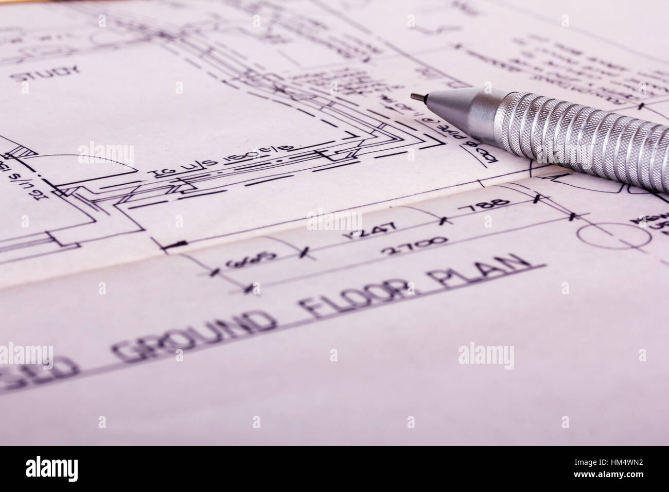 Drawing equipment on detailed architects house plans Stock Photo - Alamy
