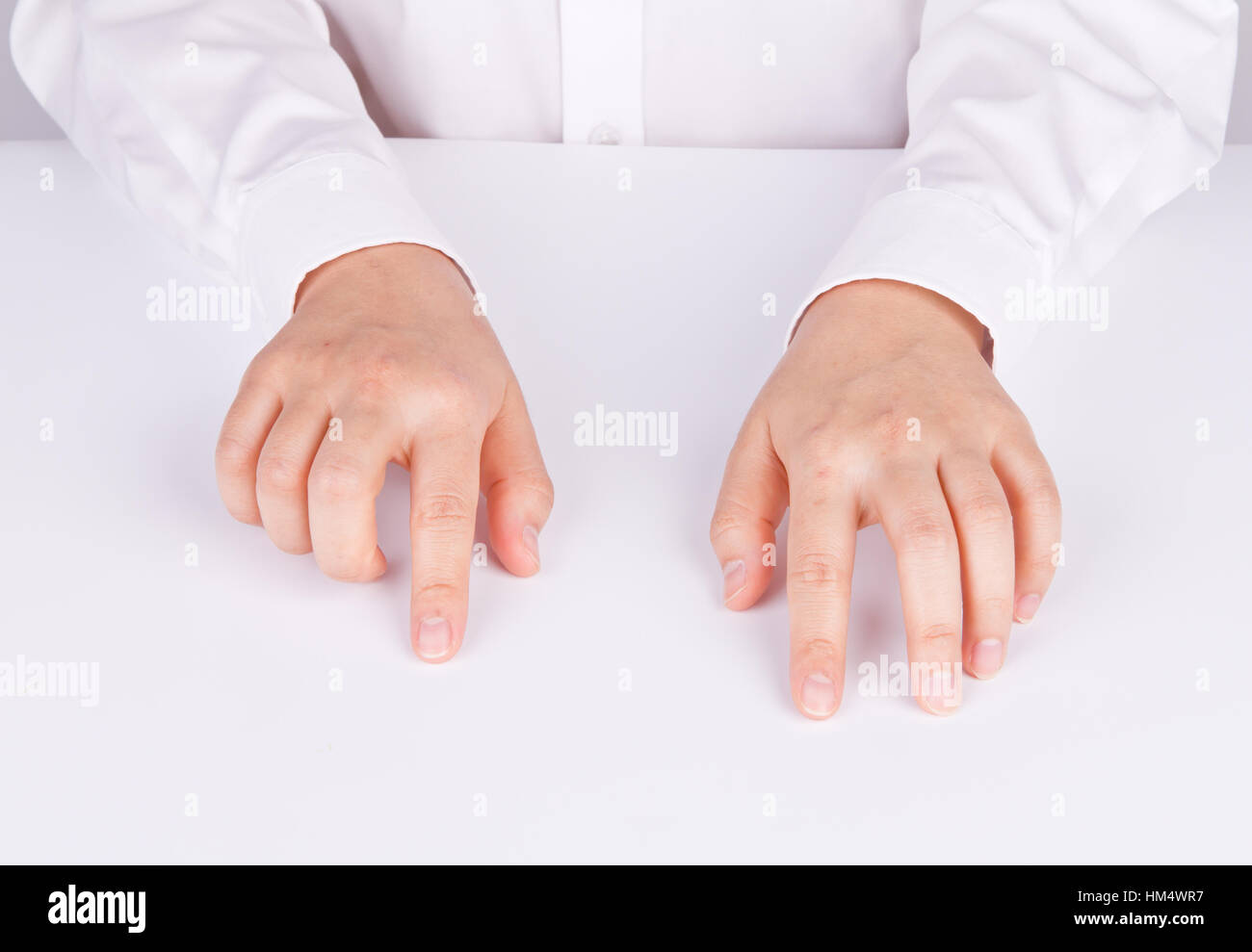 Two women's hands position like keying on keyboard on white table Stock ...
