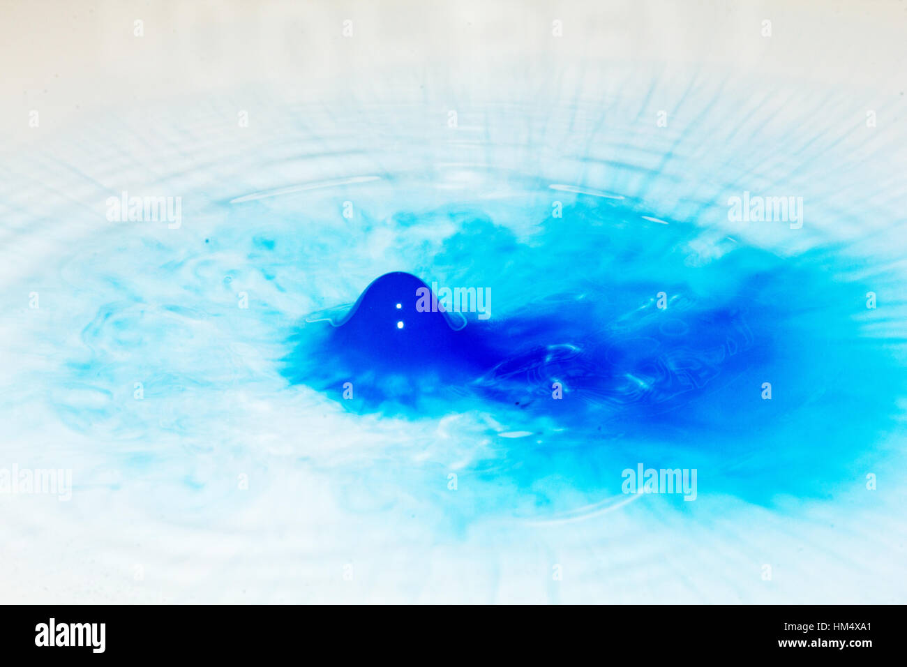 Colorful paint drop splashing on black a background Stock Photo - Alamy