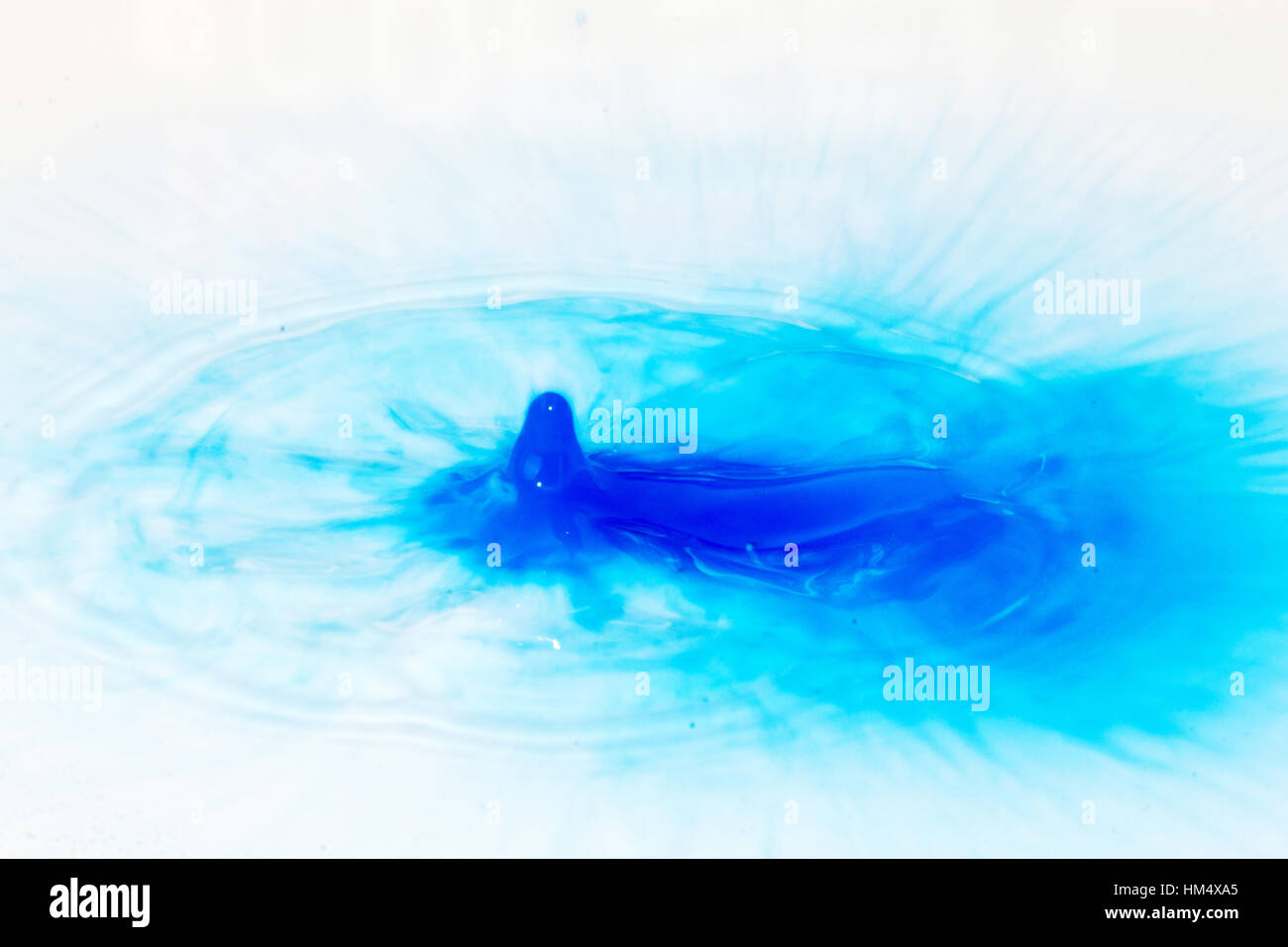 Colorful paint drop splashing on black a background Stock Photo - Alamy