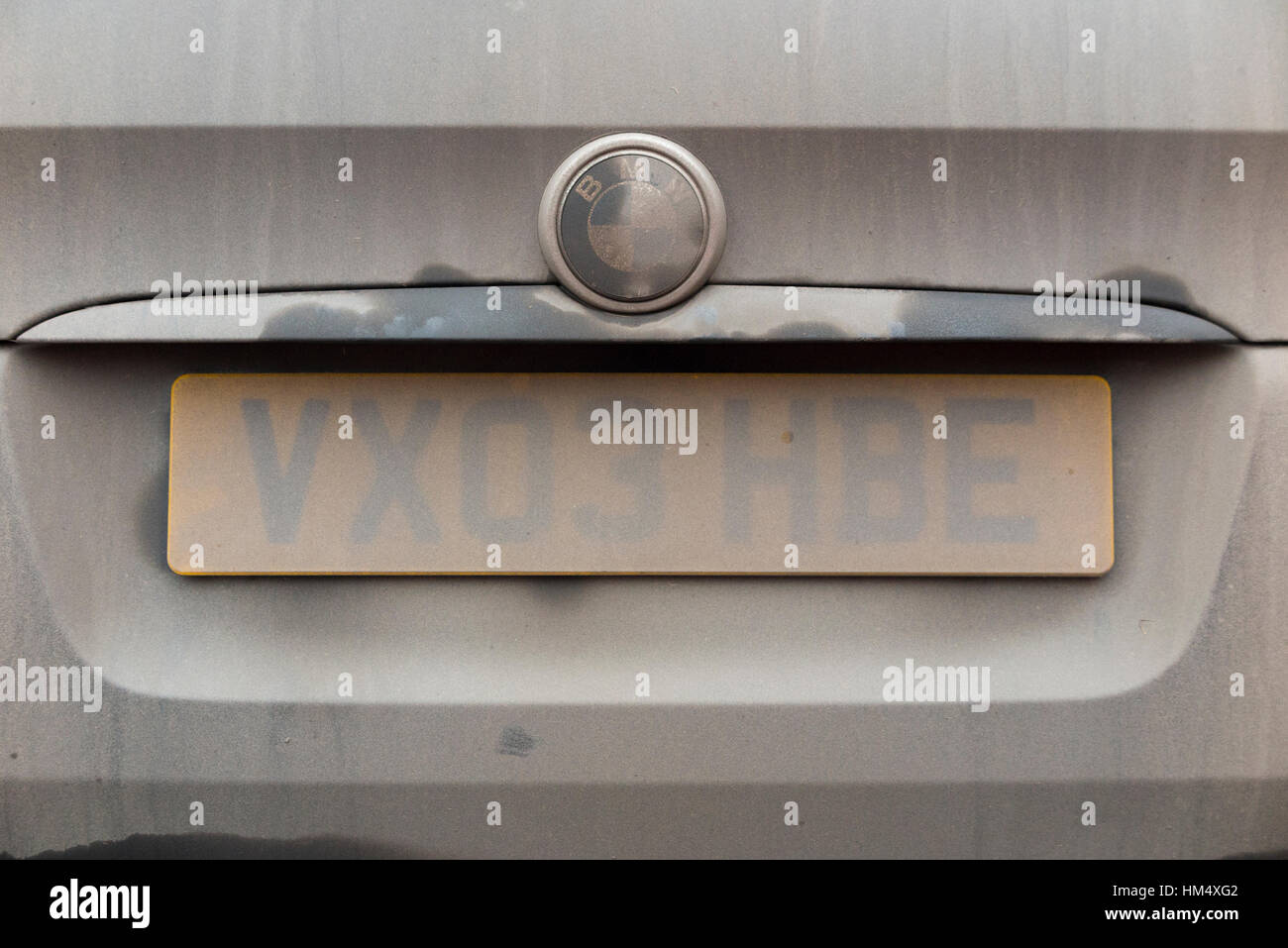 A dirty partially obscure / obscured registration number plate on a car ...