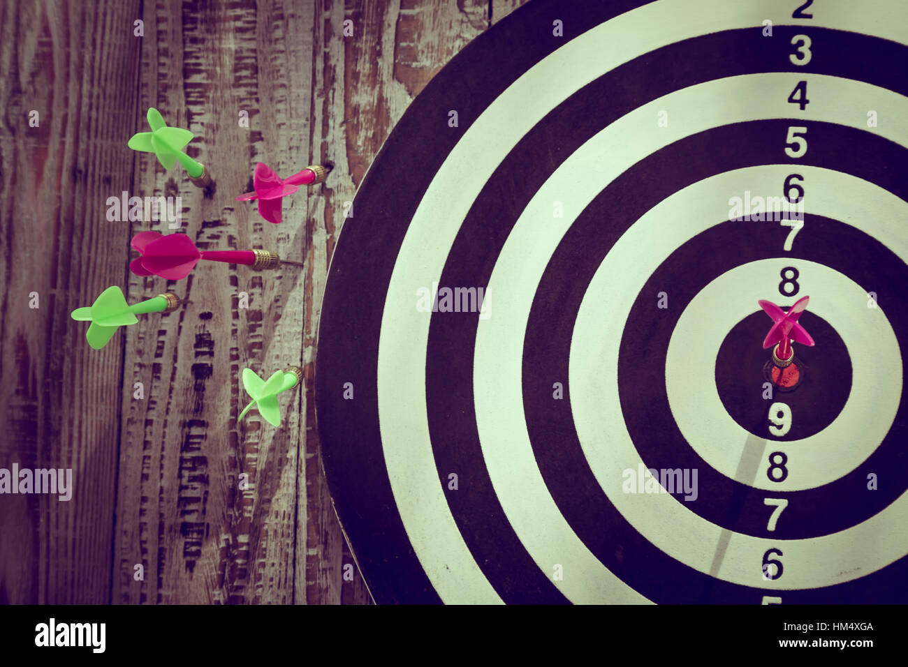 Dartboard on wood wall (miss darts Stock Photo - Alamy