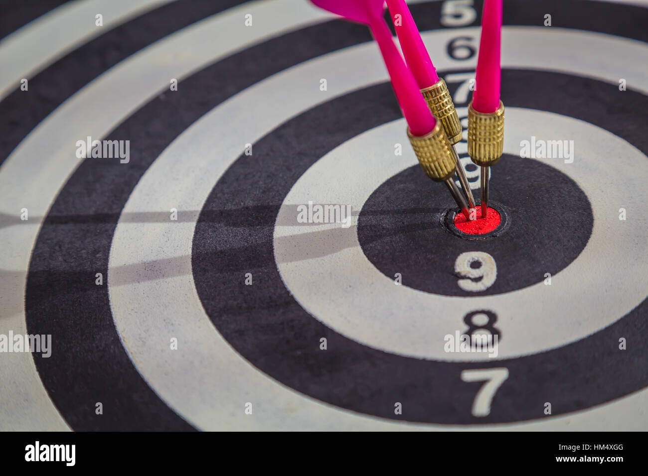 Dartboard on wood wall (Darts Hit Target Stock Photo - Alamy