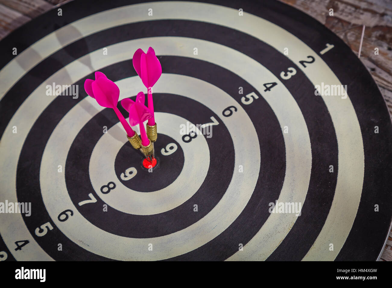 Dartboard on wood wall (Darts Hit Target Stock Photo - Alamy