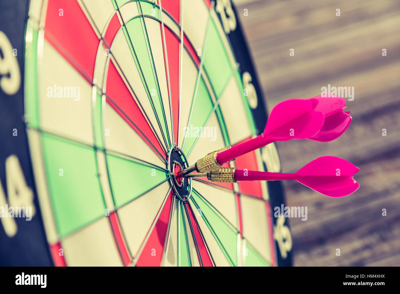 Dartboard on wood wall (Darts Hit Target Stock Photo - Alamy